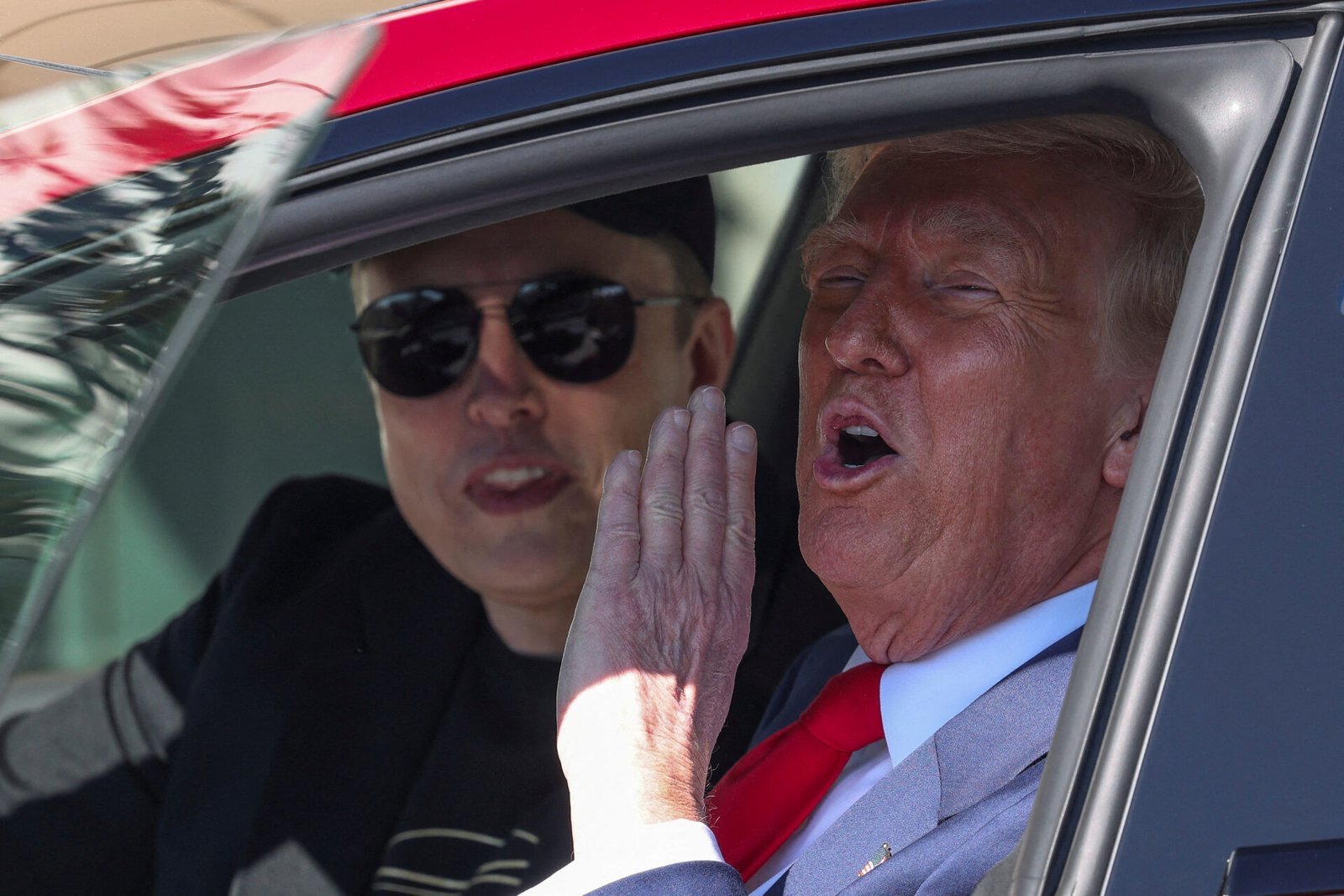 Trump commits to buying red Tesla in White House driveway to support ...