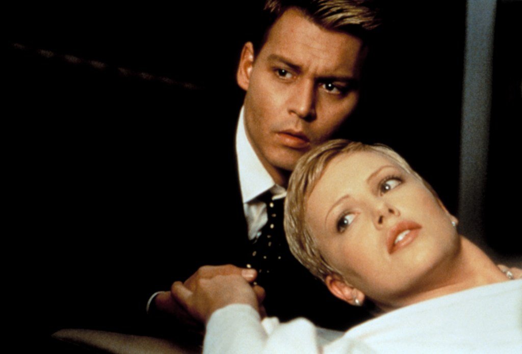 Charlize Theron appears to ignore former co-star Johnny Depp at Paris Fashion Week in awkward ...